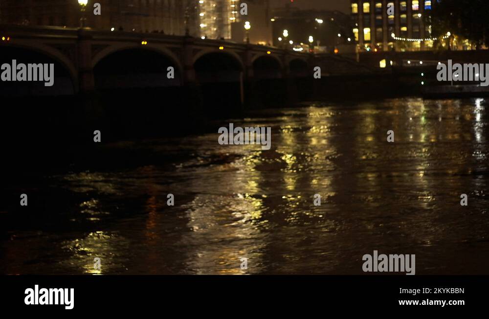 The River Flows Through The City, People Walk Along The Bridge Stock ...