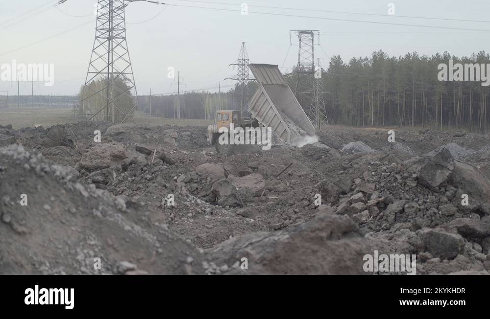 Huge dump truck in a waste slag pit Stock Video Footage - Alamy