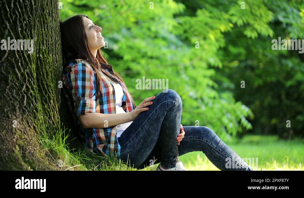 Young teenage woman relaxing tree Stock Videos & Footage - HD and 4K ...