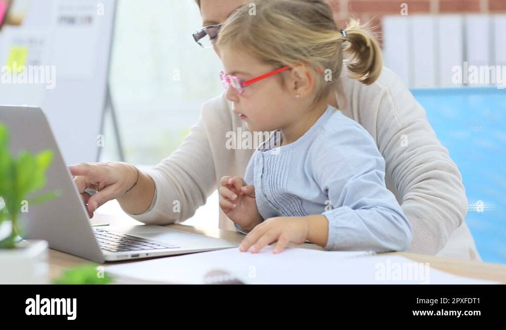 little girl and working mom sing laptop computer Stock Video Footage ...