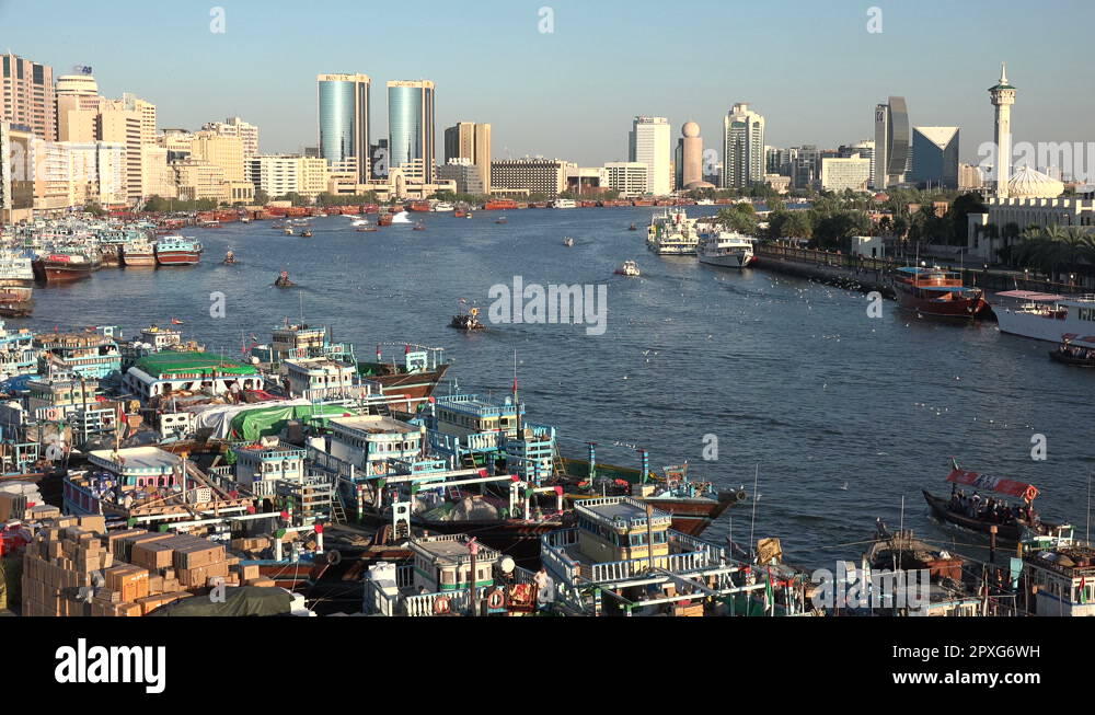 Dubai, Deira port, skyline, dhow vessels, cargo transport, harbor Stock ...