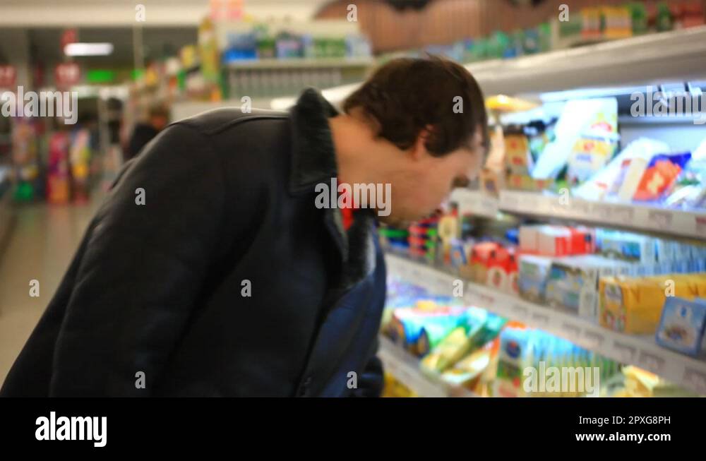 man buys dairy products at the supermarket. HD. 1920x1080 Stock Video ...