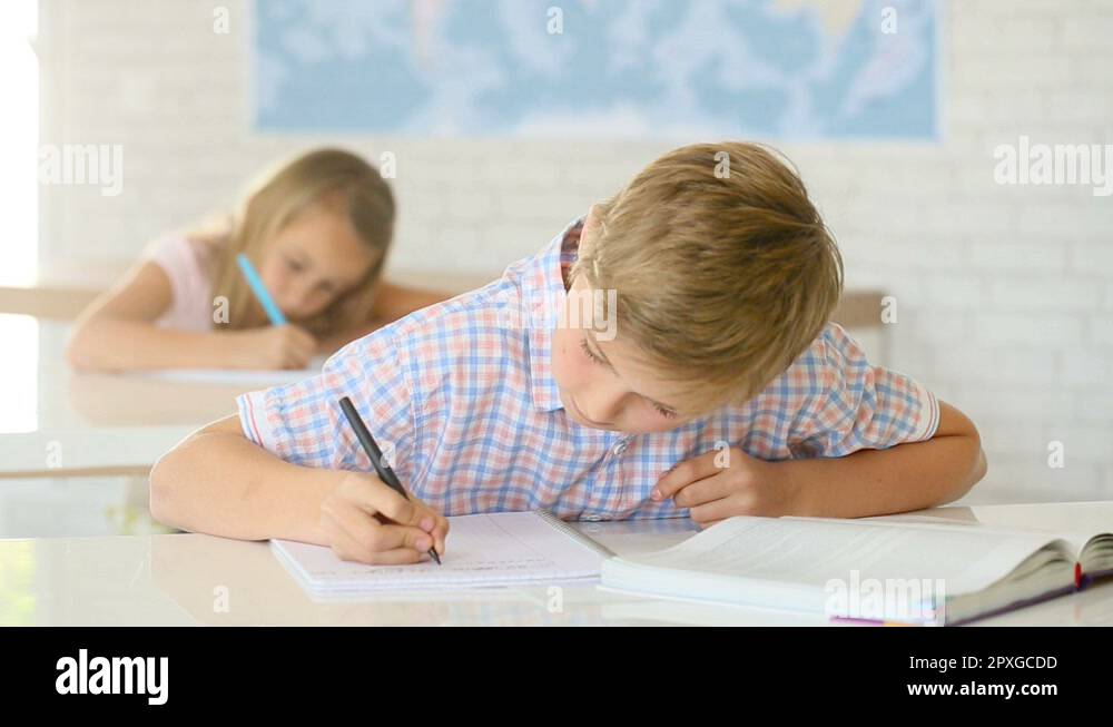 Boy in classroom writing Stock Videos & Footage - HD and 4K Video Clips ...