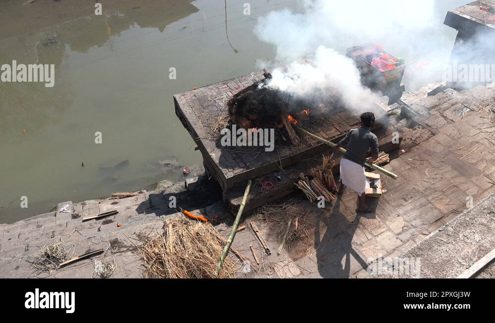 Nepal religion, Hinduism, public cremation, burning corpse, deceased ...