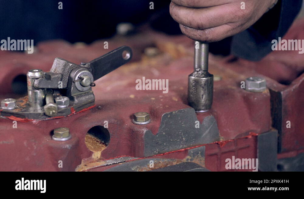 Worker tight nuts on motor, engine by automatic screwdriver Stock Video ...