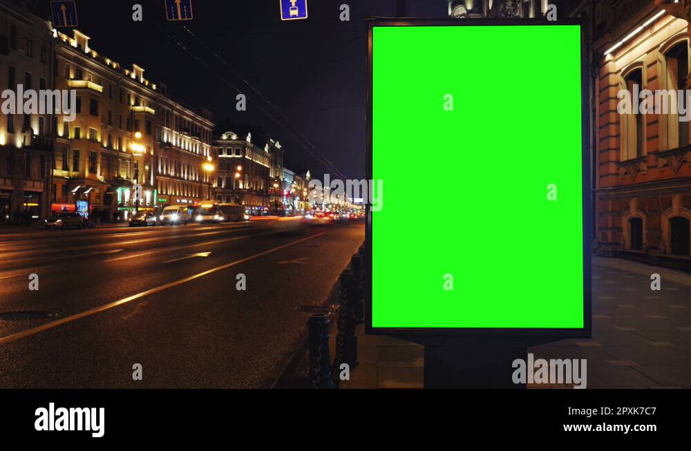 A Billboard with a Green Screen on a Busy Night Street.Time Lapse Stock ...