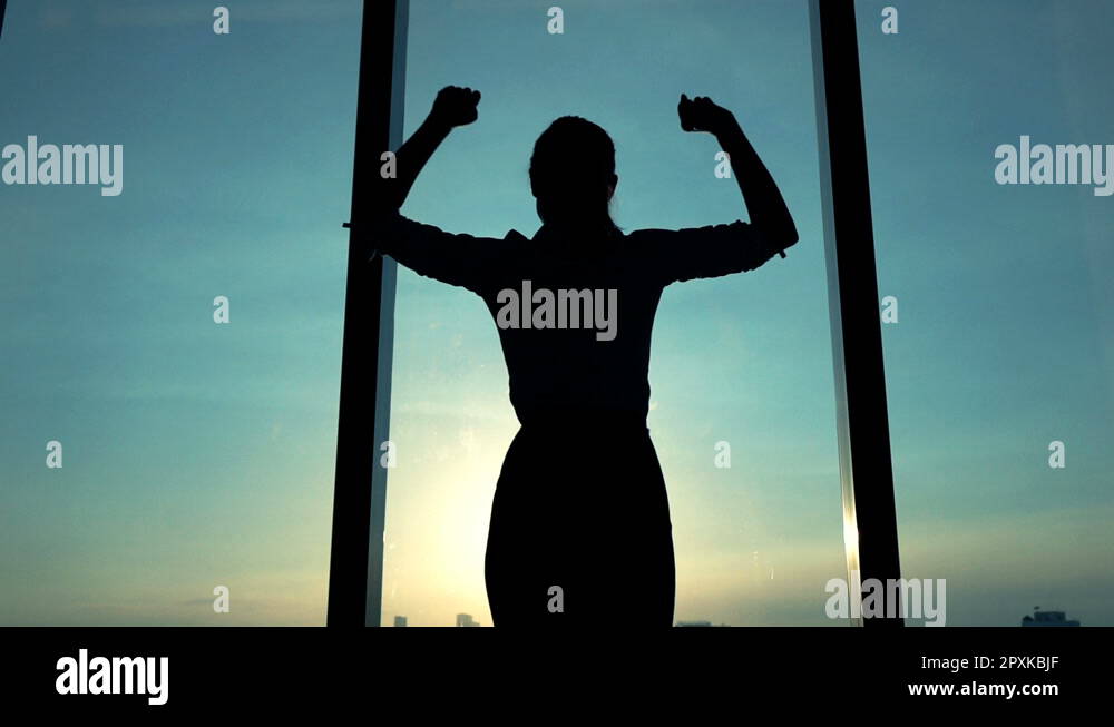 Successful businesswoman raising arms, power symbol above city, super ...
