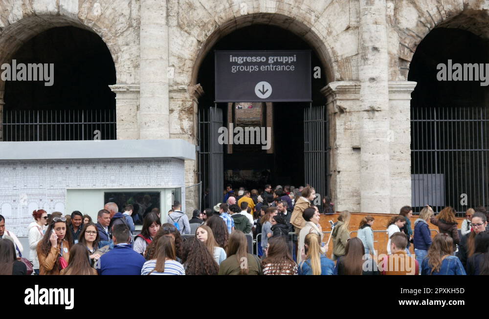 Crowd tourists stand in a queue by Entrance of Colosseum - Rome Italy ...