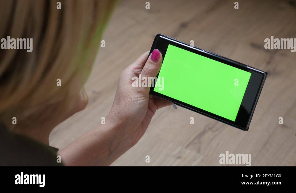 Female relaxing indoor green screen mobile phone display 4K 2160p 30fps ...