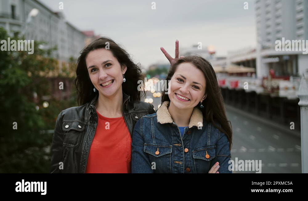 Two girls laughing standing Stock Videos & Footage - HD and 4K Video ...