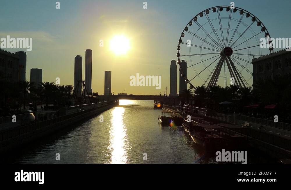 Al Qasba canal and ferris wheel in Sharjah city, United Arab Emirates ...