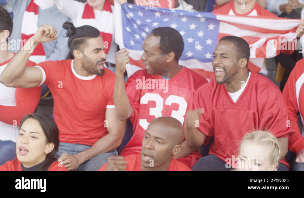 4K Male friends in stadium sports crowd, watching game & cheering on ...