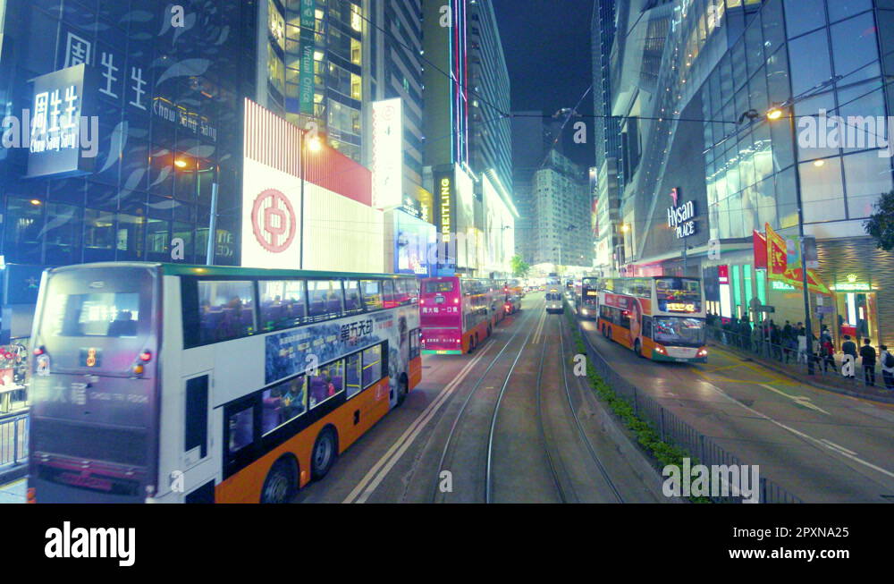 BUSES PASS TRAMS CAUSEWAY BAY HONG KONG CHINA Stock Video Footage - Alamy