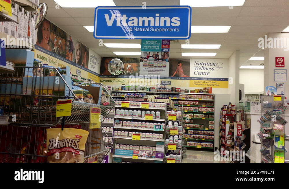 Close up vitamins sign and display health foods inside London drugs ...