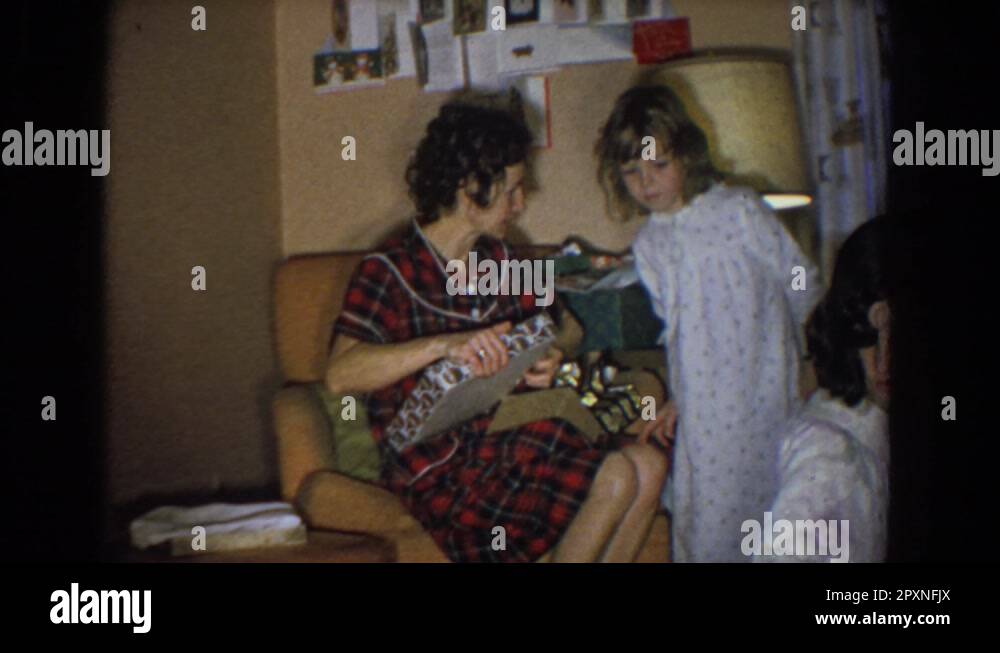 1965: children of different ages are sorting and checking the presents ...