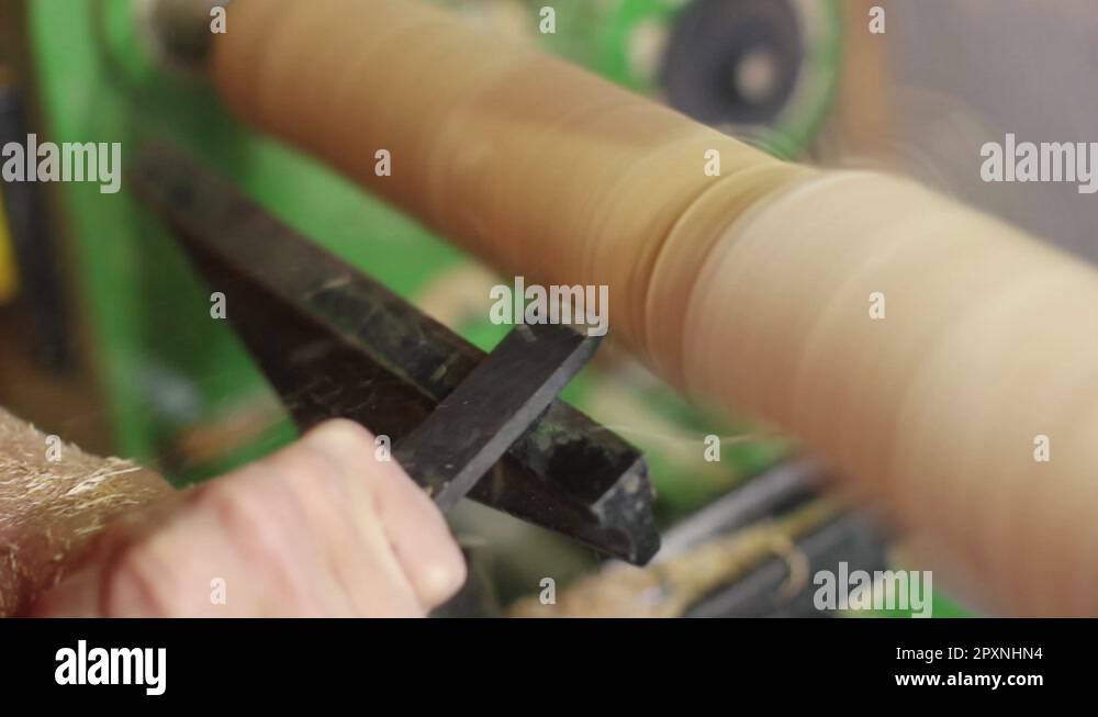 Foot operated spring pole wood lathe. Man operating a foot operated ...