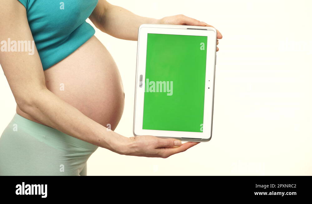 Pregnant woman holds tablet showing green screen 4K Stock Video Footage ...