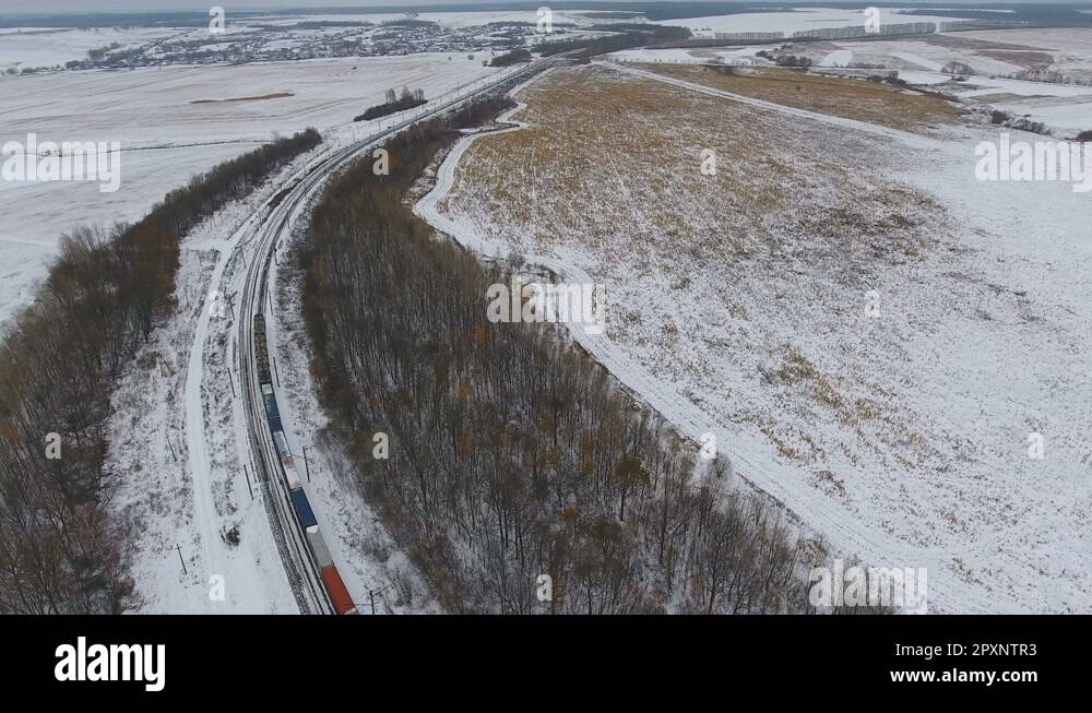 Railroad delivery. Freight train with cargo vagons and tanks passing by ...