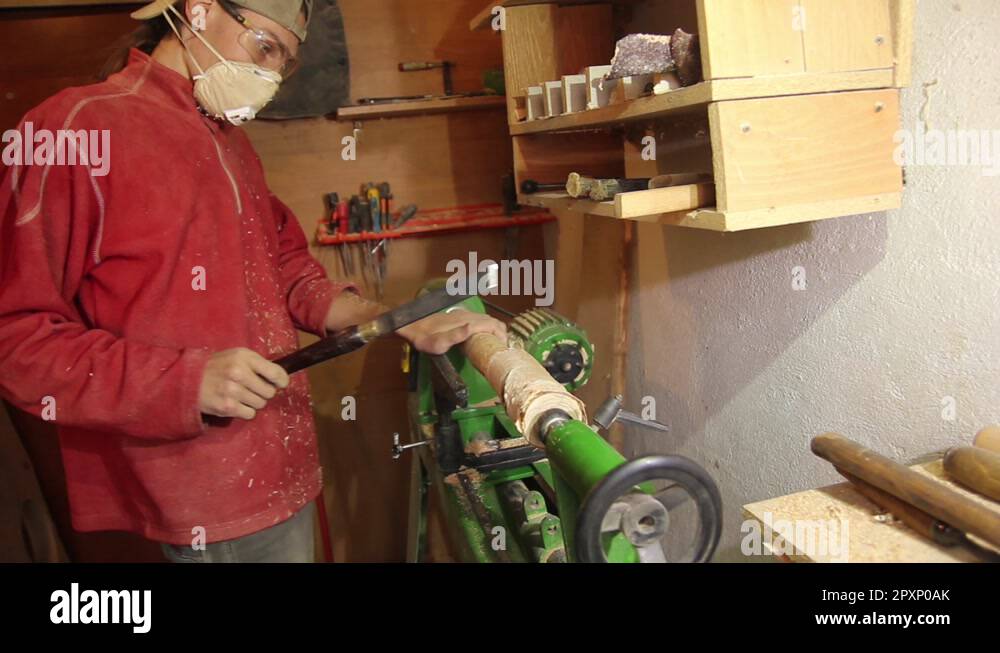 Foot operated spring pole wood lathe. Man operating a foot operated ...
