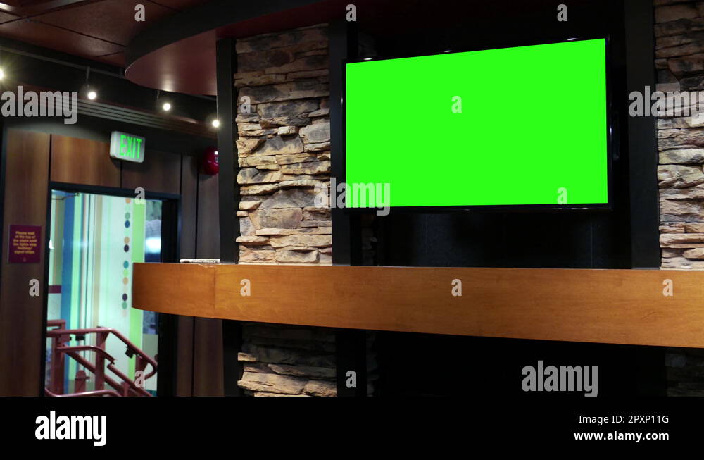 Display tv with green screen inside mcdonalds fast food restaurant ...