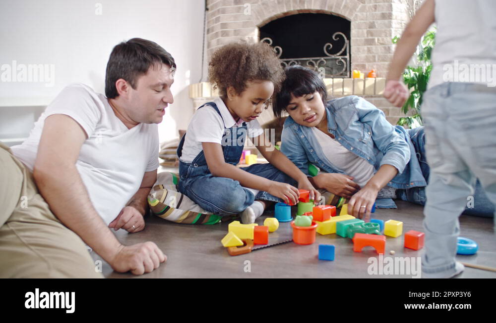 Parents and Kids Playing with Blocks Together Stock Video Footage - Alamy