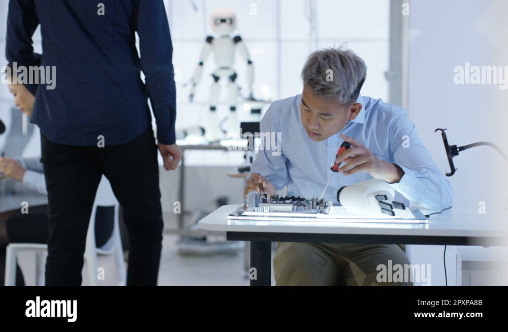 4K Technical design team working on construction of robot in modern lab ...