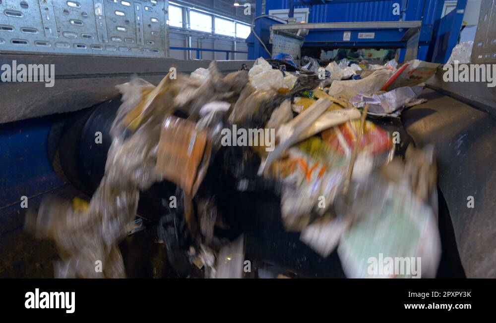 Trash conveyor system. Garbage moving on a conveyor belt Stock Video Footage - Alamy