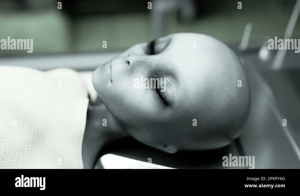 The dead alien in the morgue on the table. Futuristic autopsy concept ...