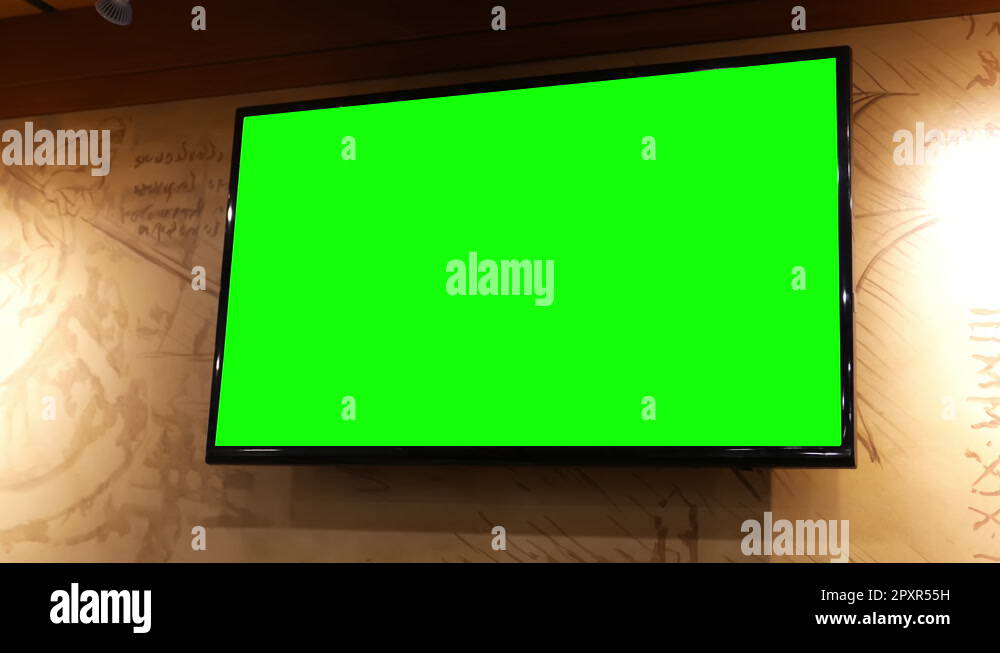 Motion of display tv with green screen inside restaurant on wall Stock ...