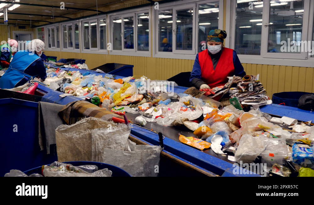 Trash workers sorting trash, garbage at a recycling plant conveyor Stock Video Footage - Alamy