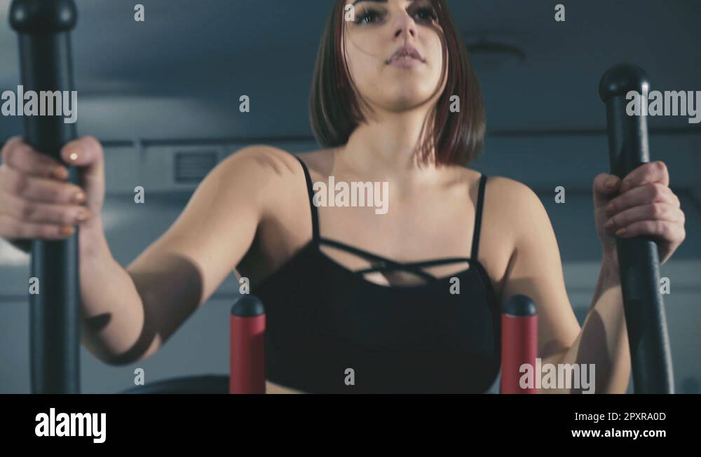 Pretty girl exercises on stepper in the gym in 4K Stock Video Footage ...