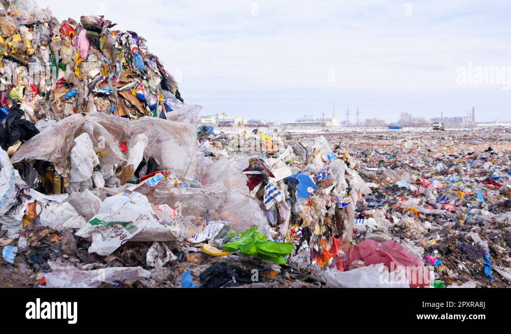 Big piles of garbage. Plastic, packages, polyethylene in a garbage dump ...