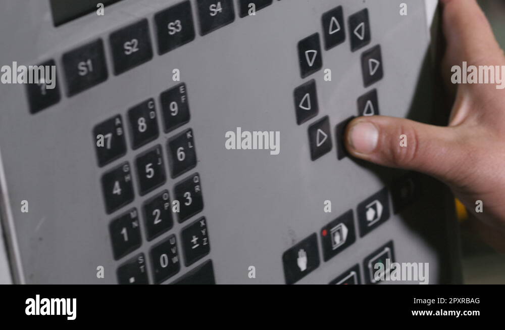 Worker programming Industrial control panel display. Modern automated ...