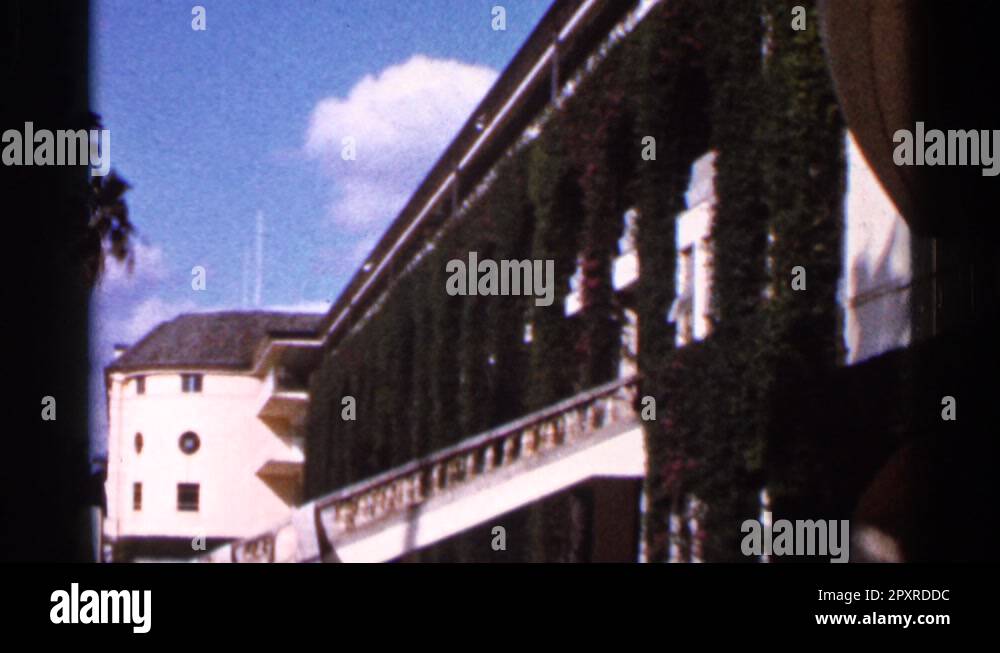 1966: building with decorative, creeping plants, coconut tree ...