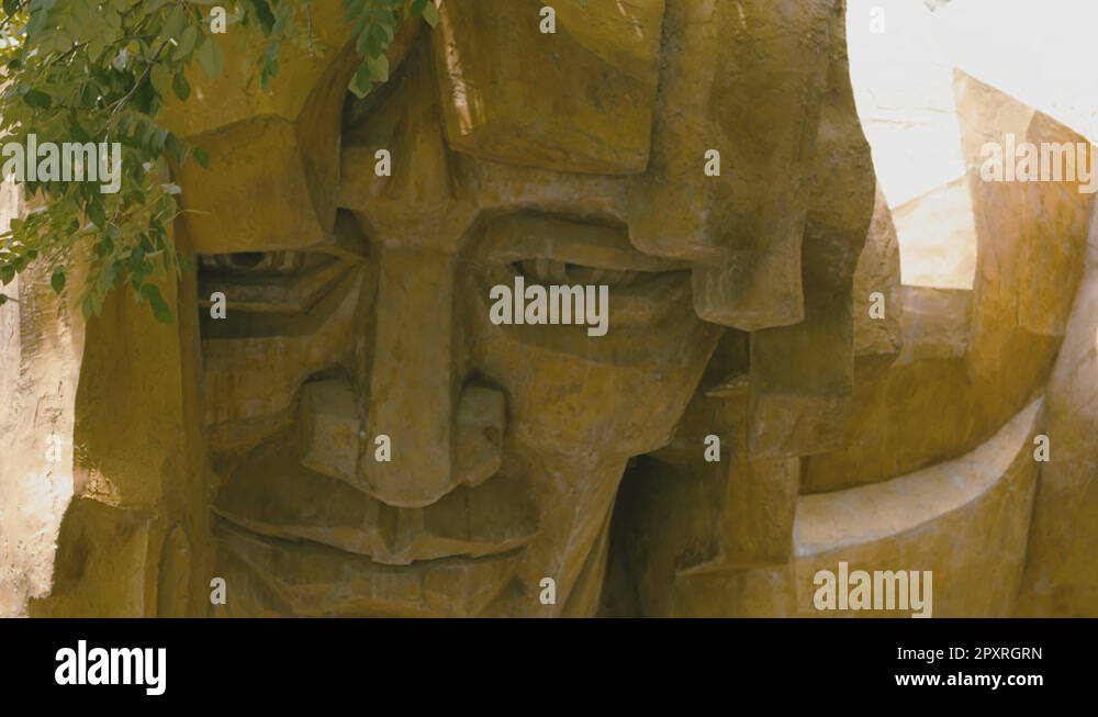 Gold sculpture of a man's face close-up Stock Video Footage - Alamy