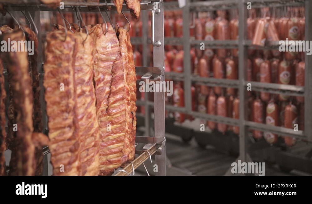 Sausages, grilled ribs, meat products at a storage rack in a food ...