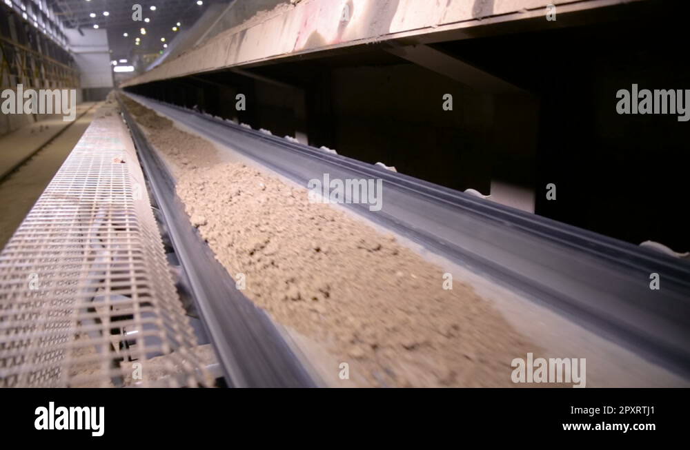 Soil, clay moving on conveyor belt. Soil, gravel, separation and ...