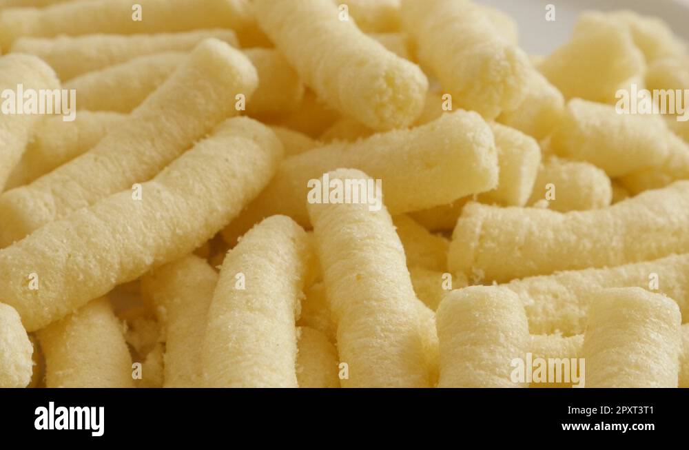 Corn flips puffs unhealthy food background slow tilt Stock Video ...