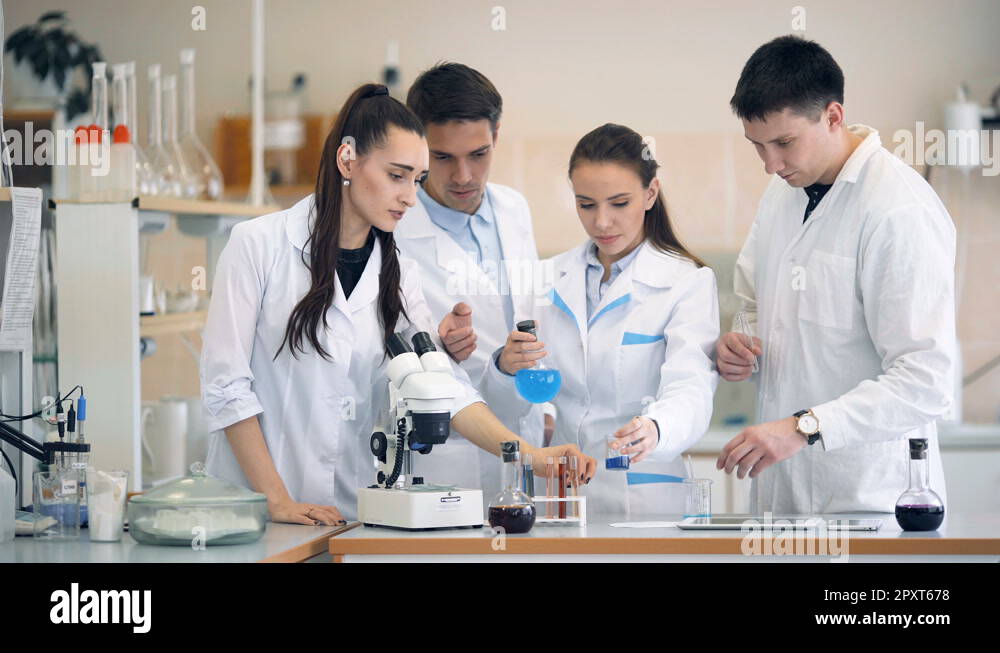 Scientists in lab looking beaker Stock Videos & Footage - HD and 4K ...