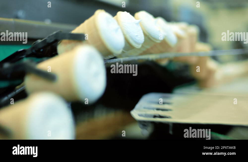 Ice cream production line. Row of ice cream on conveyor line. Food ...