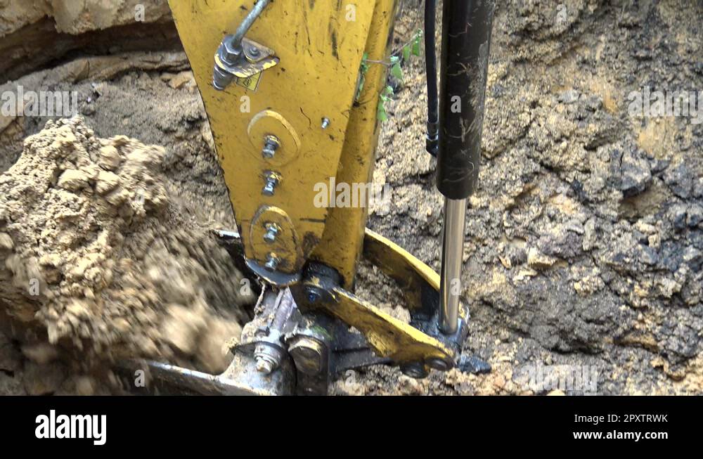 Tractor excavator digging the pit with a big scoop Stock Video Footage ...