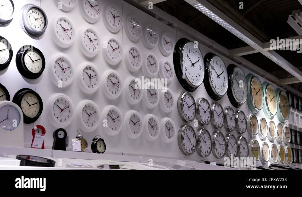 Motion of full wall display clocks inside Ikea store with 4k resolution ...