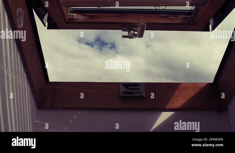 Beautiful nature view through roof skylight window in attic room ...
