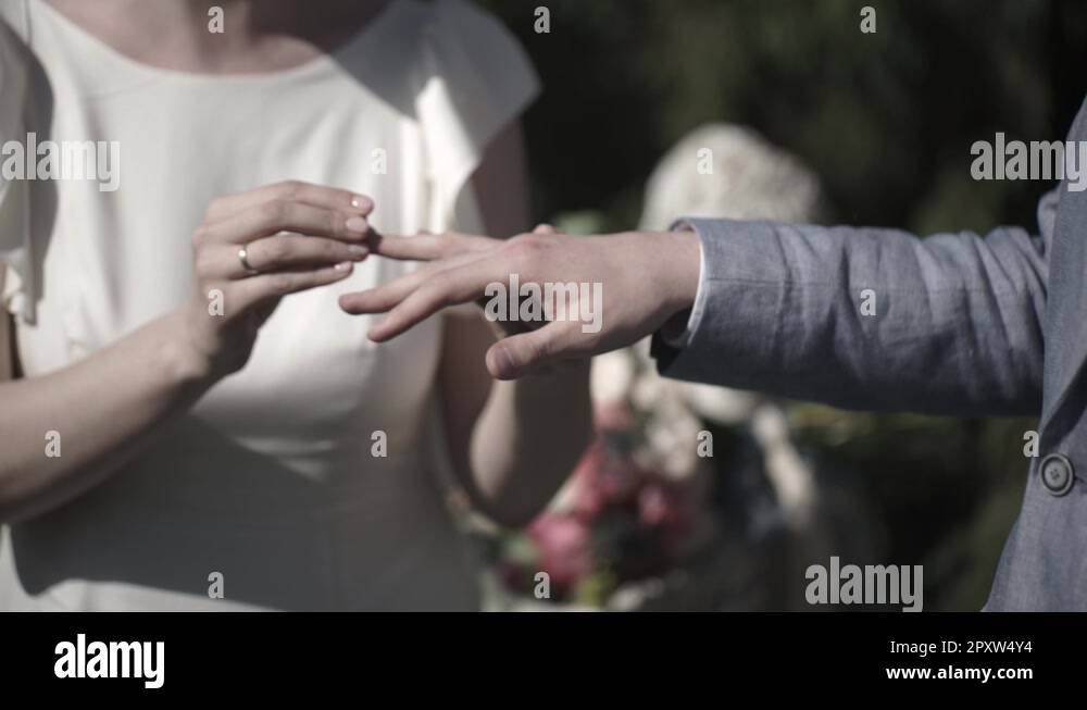 Fiancee puts a ring on a finger to fiance. Ceremony of donning wedding ...