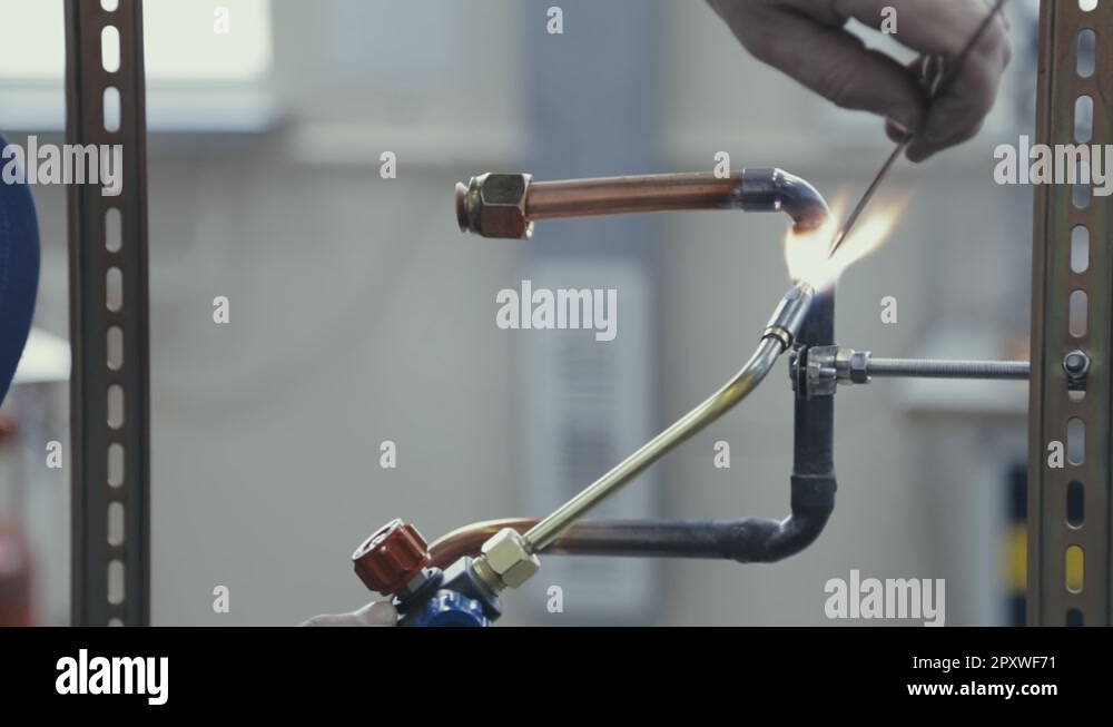 Craftsman soldering copper pipe Stock Videos & Footage - HD and 4K ...