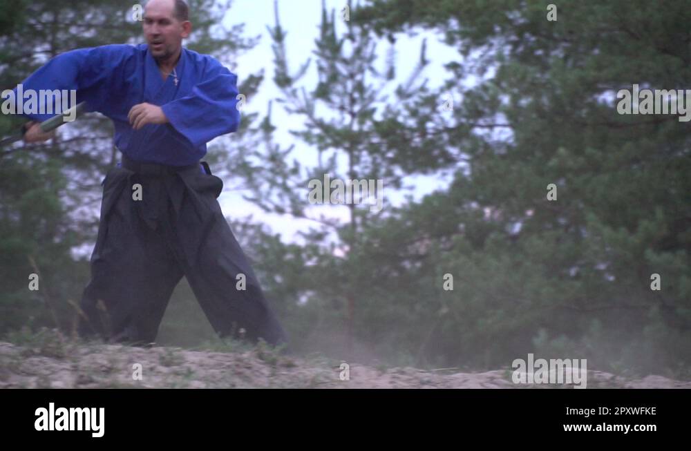 Samurai with a katana pushes a warrior with a halberd and becomes in a ...