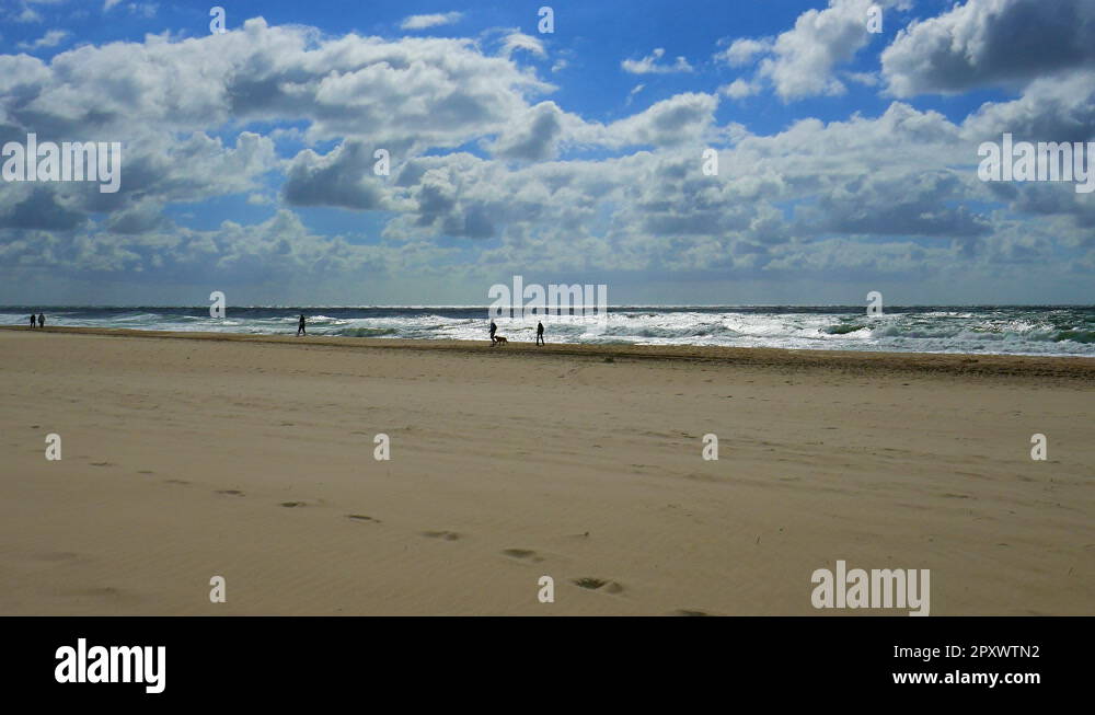 surge of waves on the beach of sylt island with people Stock Video ...