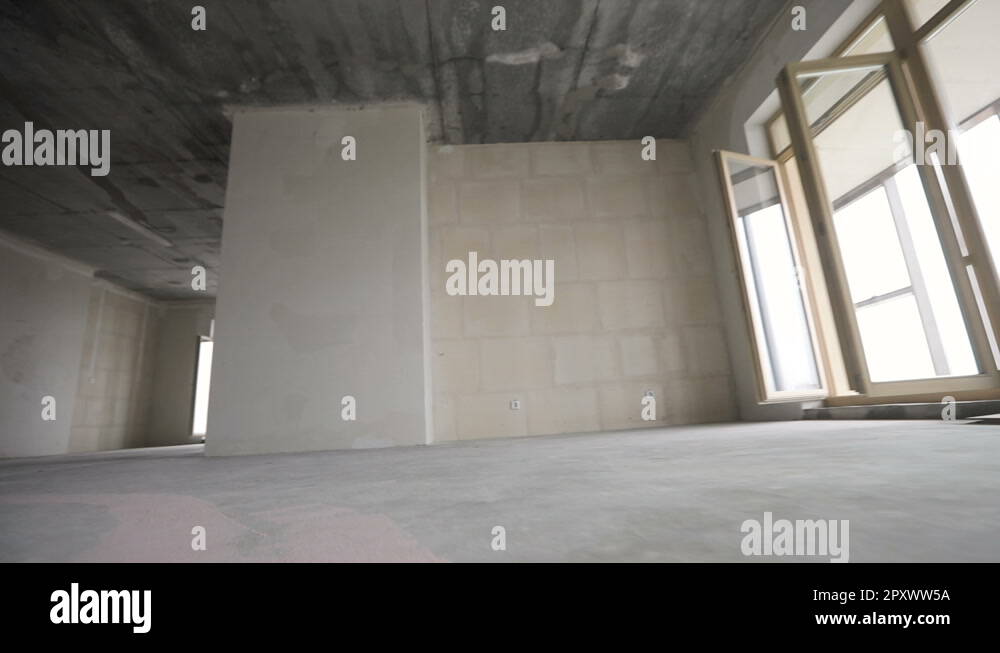 moving in new home. Overview of empty room with bare walls, ceiling ...