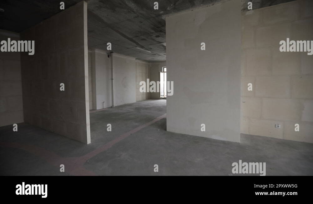 moving in new home. Overview of empty room with bare walls, ceiling ...