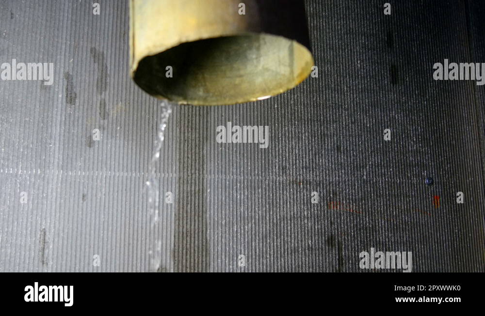 Water is pouring from the pipe Stock Video Footage - Alamy